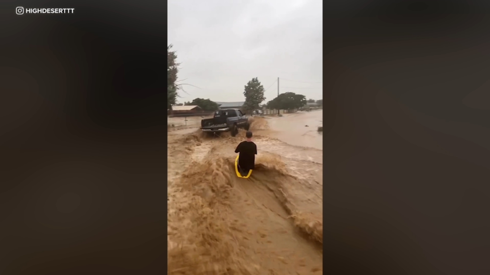 Video shows man kneeboarding in muddy floodwaters in Hesperia - ABC7 ...