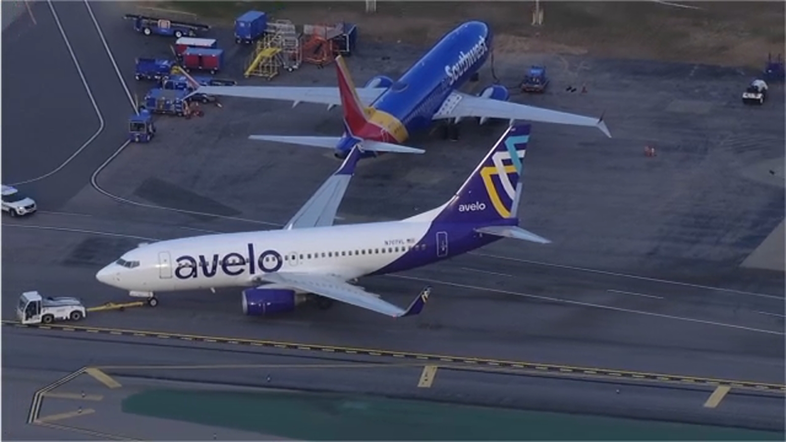 Avelo plane being towed clips wing of parked Southwest plane at Raleigh ...
