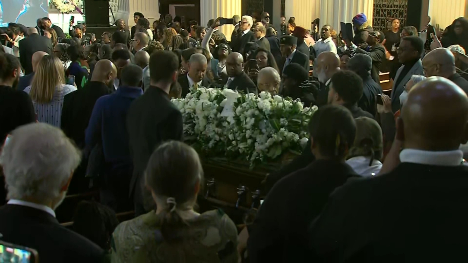 Rev. Jackson's casket carried out of Rainbow PUSH HQ following services ...
