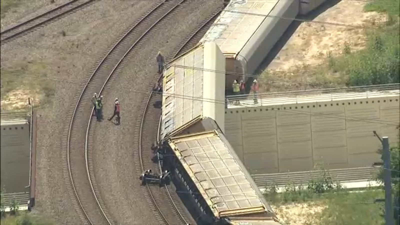 Train cars seen hanging off overpass in NW Houston - ABC13 Houston