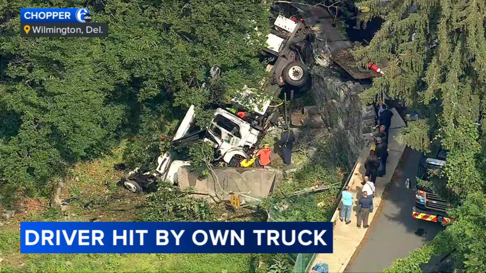 Driver struck by trailer while jumping from vehicle before truck falls ...