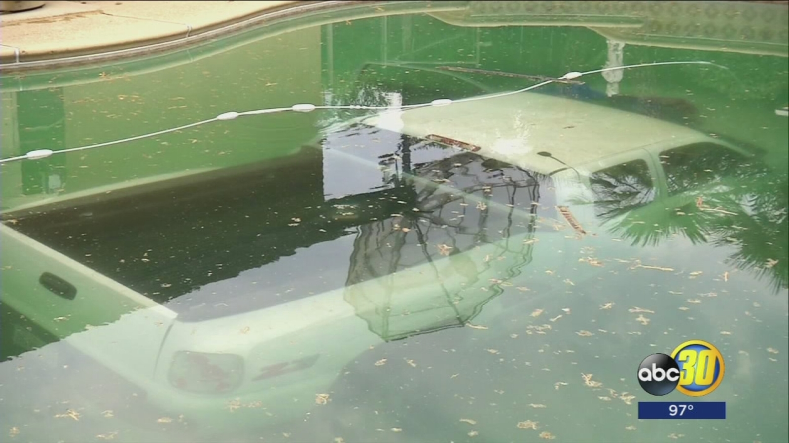 Truck ends up in pool after smashing through the fence of a Visalia ...