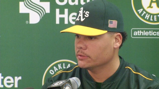 Oakland A's catcher Bruce Maxwell kneels during national anthem before ...