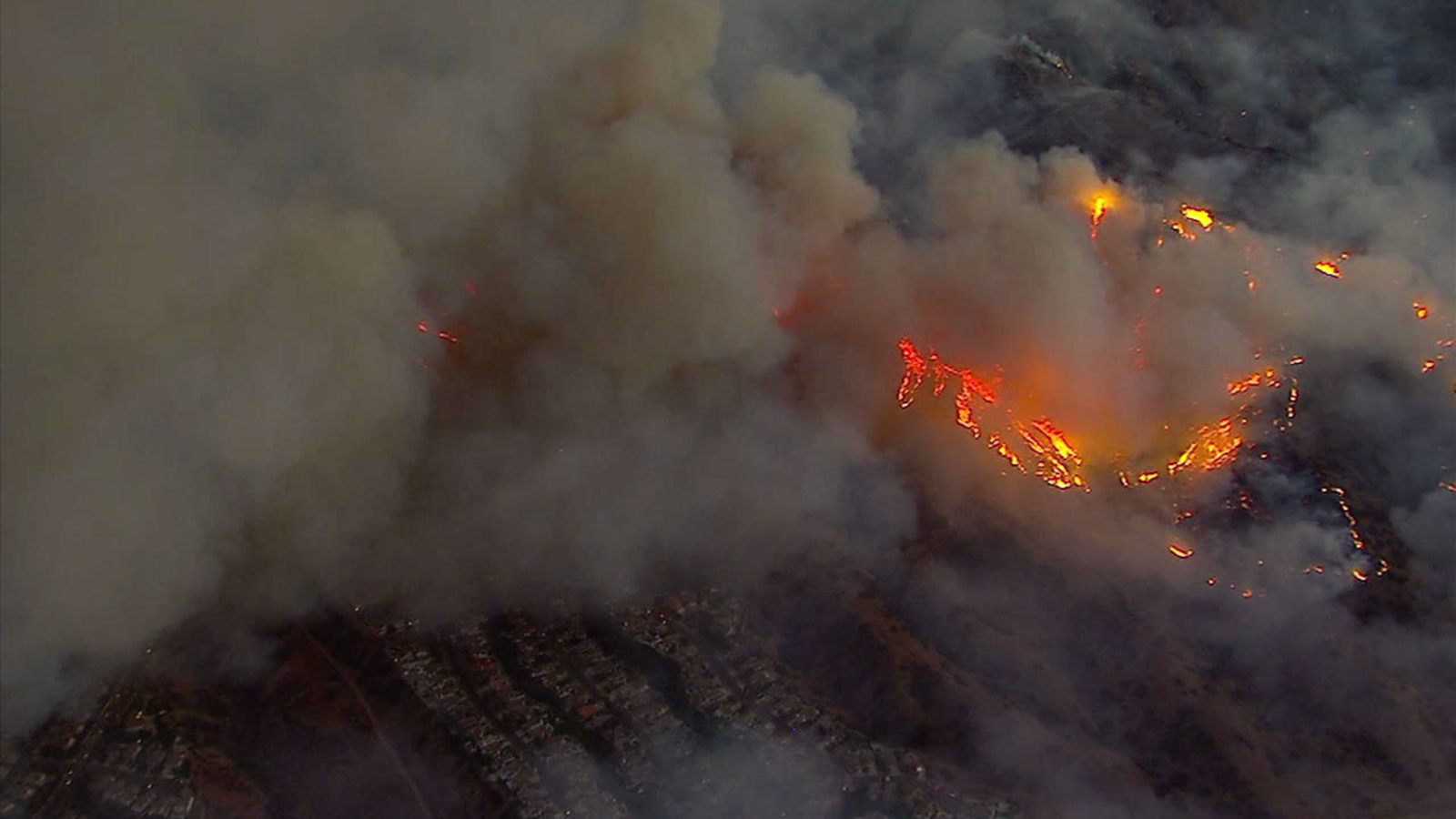 Fast-moving brush fire burning near Anaheim-Corona border prompts ...