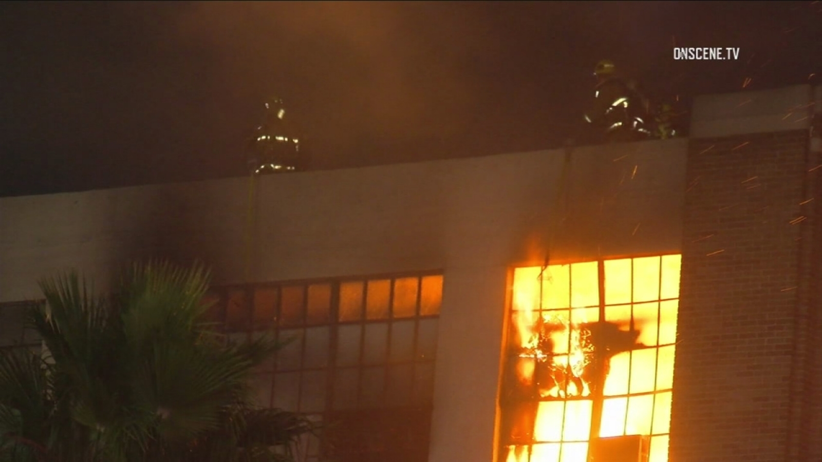 Fire engulfs top floor of 4-story commercial building in downtown Los ...