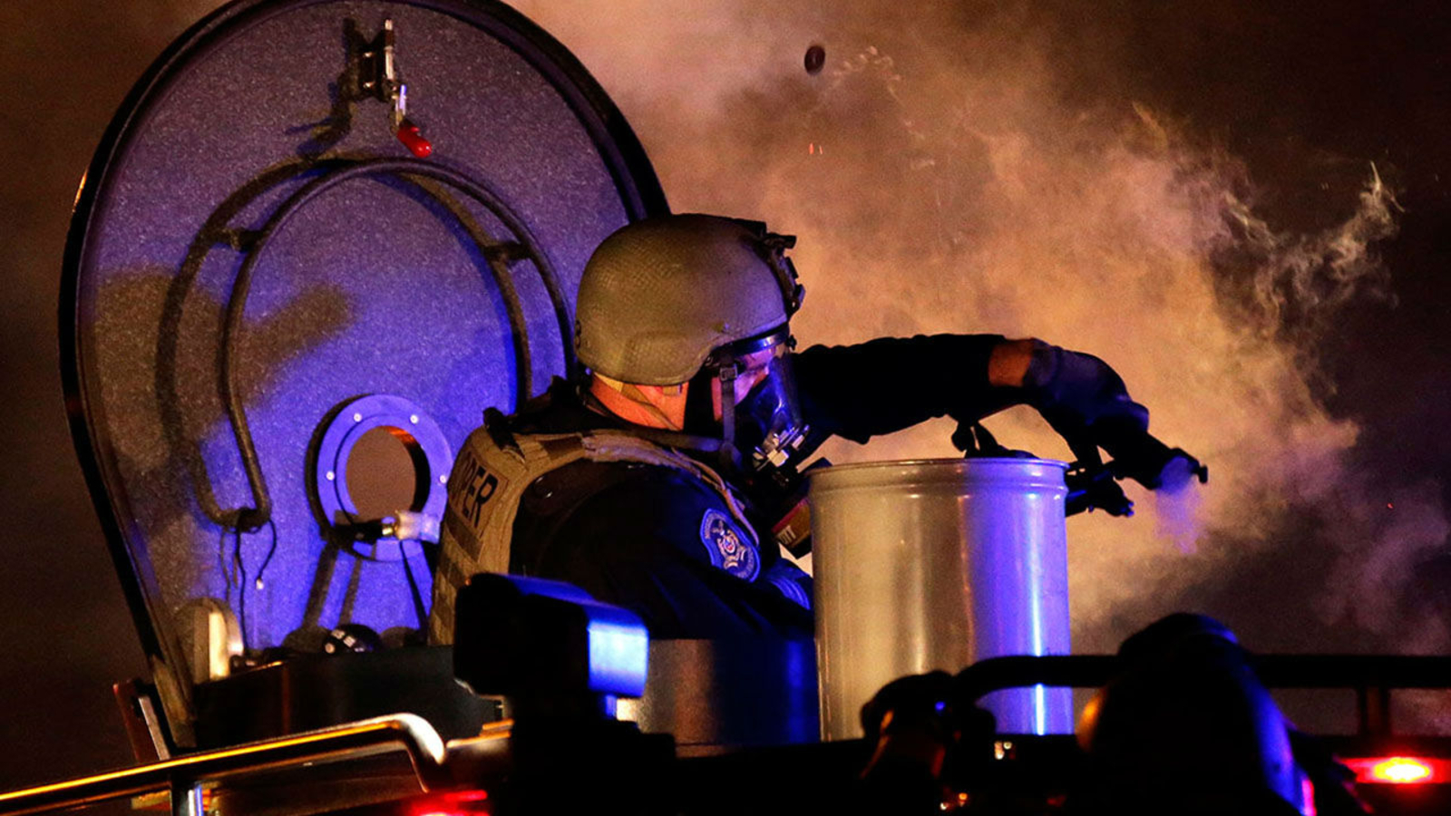 Protesters and police clash in Ferguson, Missouri over shooting death ...