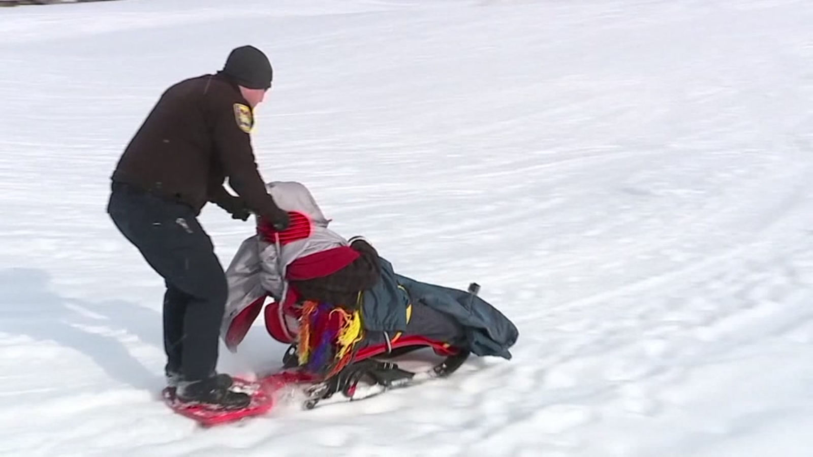 Police, firefighters take man with disabilities sledding for first time ...