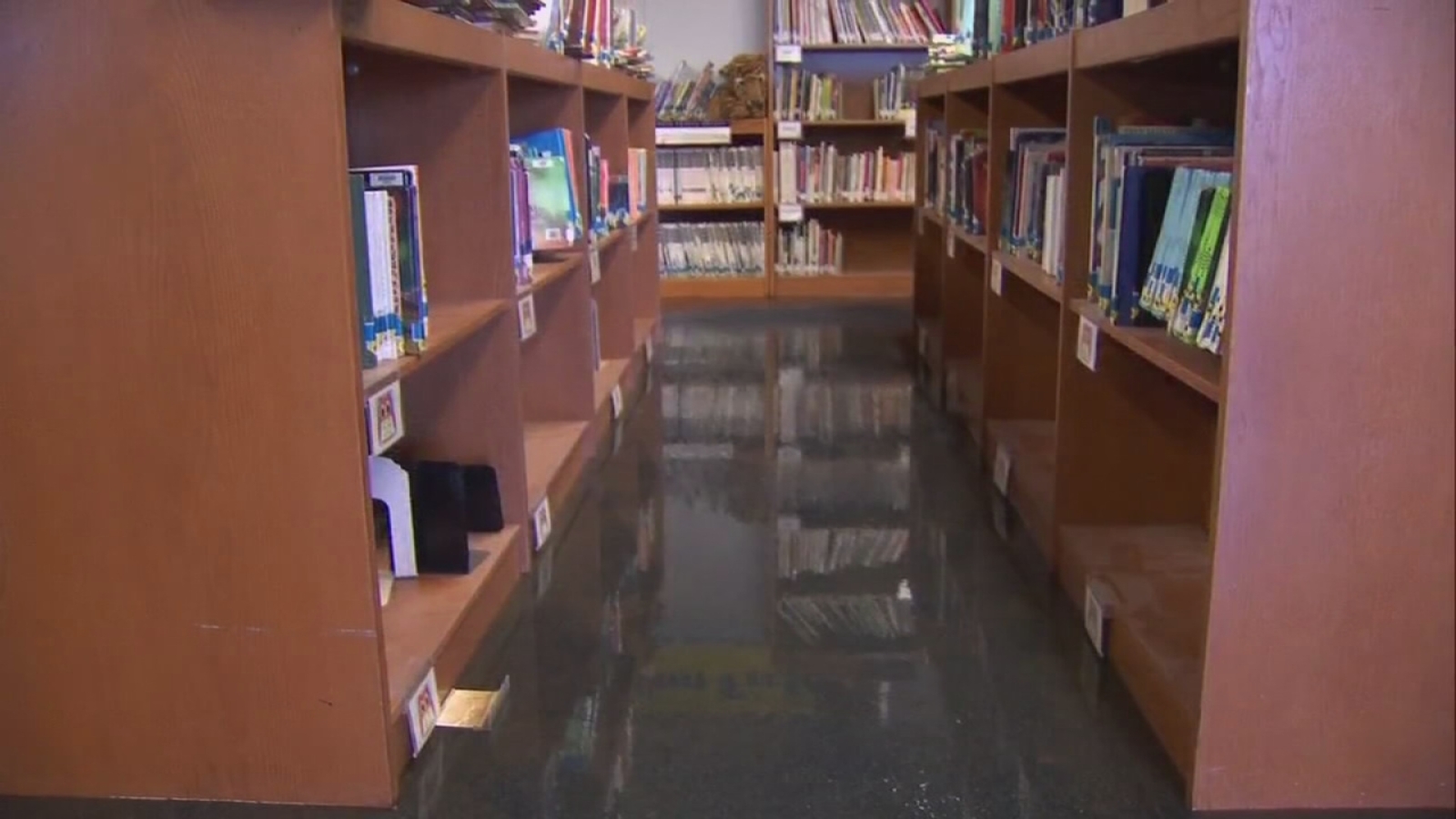 Staff cleaning up after Planada Elementary flooded by swollen creek ...