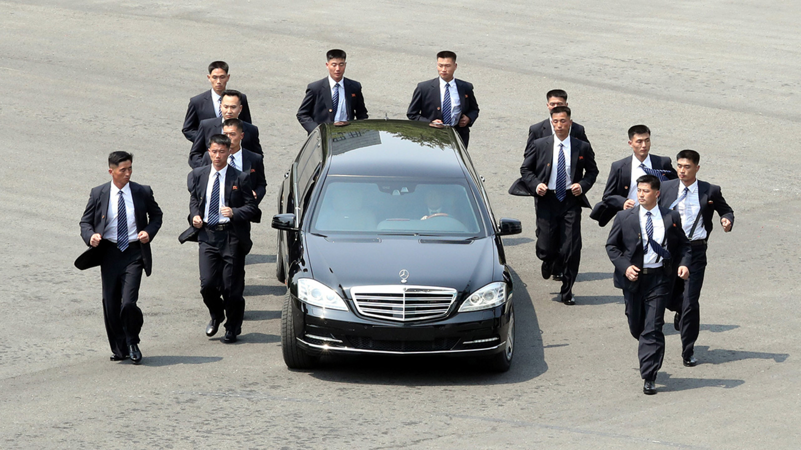 Kim Jong Un's jogging bodyguards run alongside leader's limo at inter ...