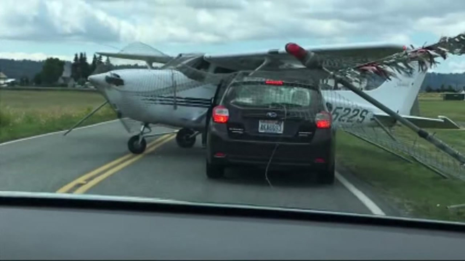 CLOSE CALL: Plane inches away from hitting women's vehicle after ...