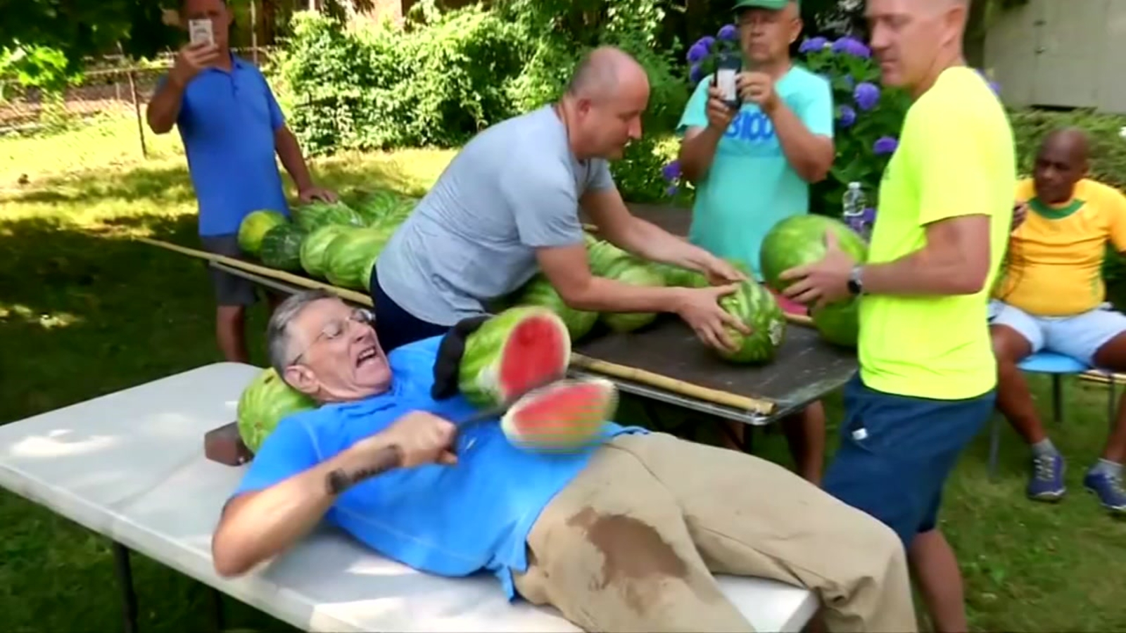Man sets record for slicing most watermelons in half on his stomach ...