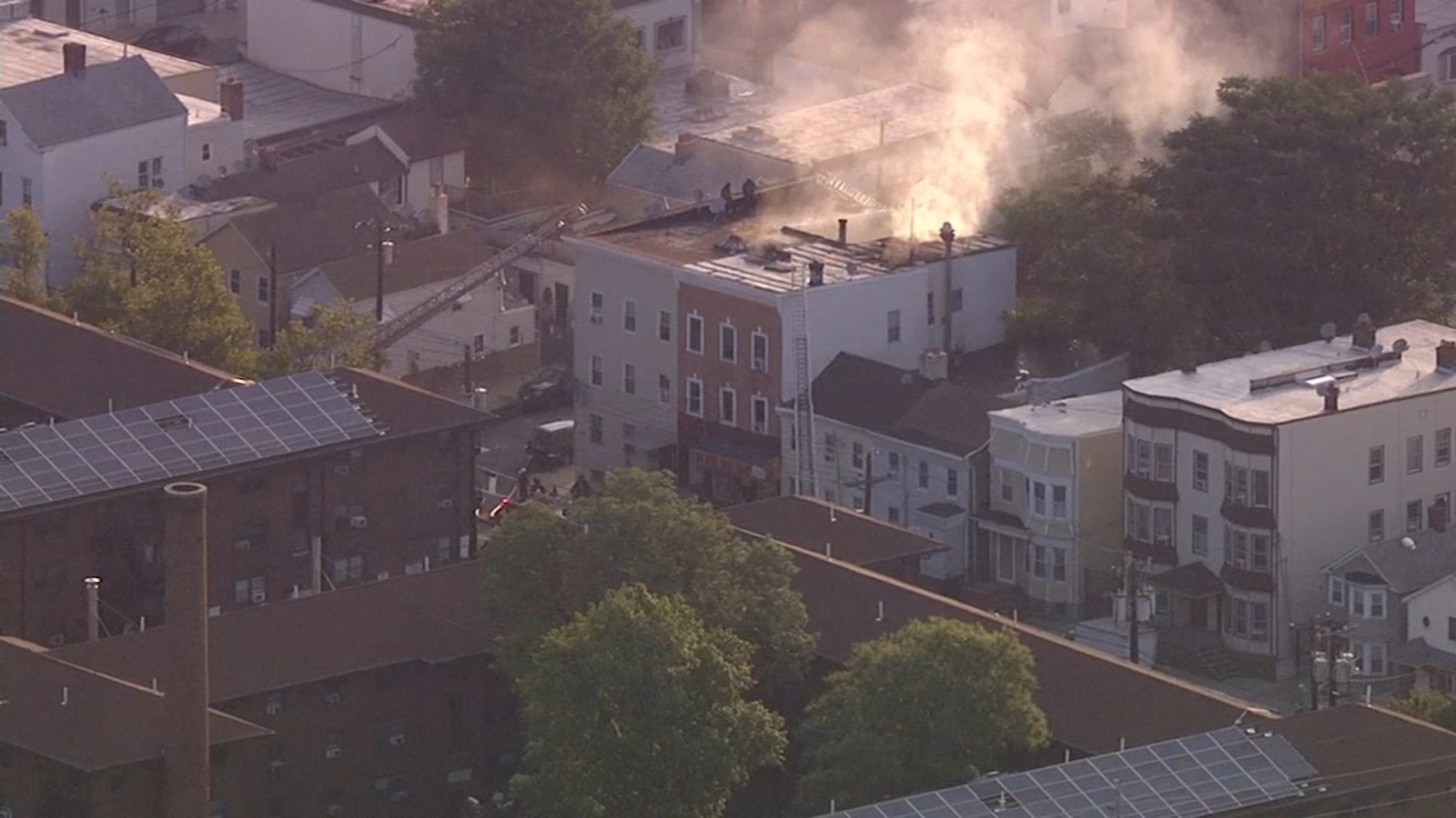 Firefighter falls off roof while battling Newark fire, breaks foot ...
