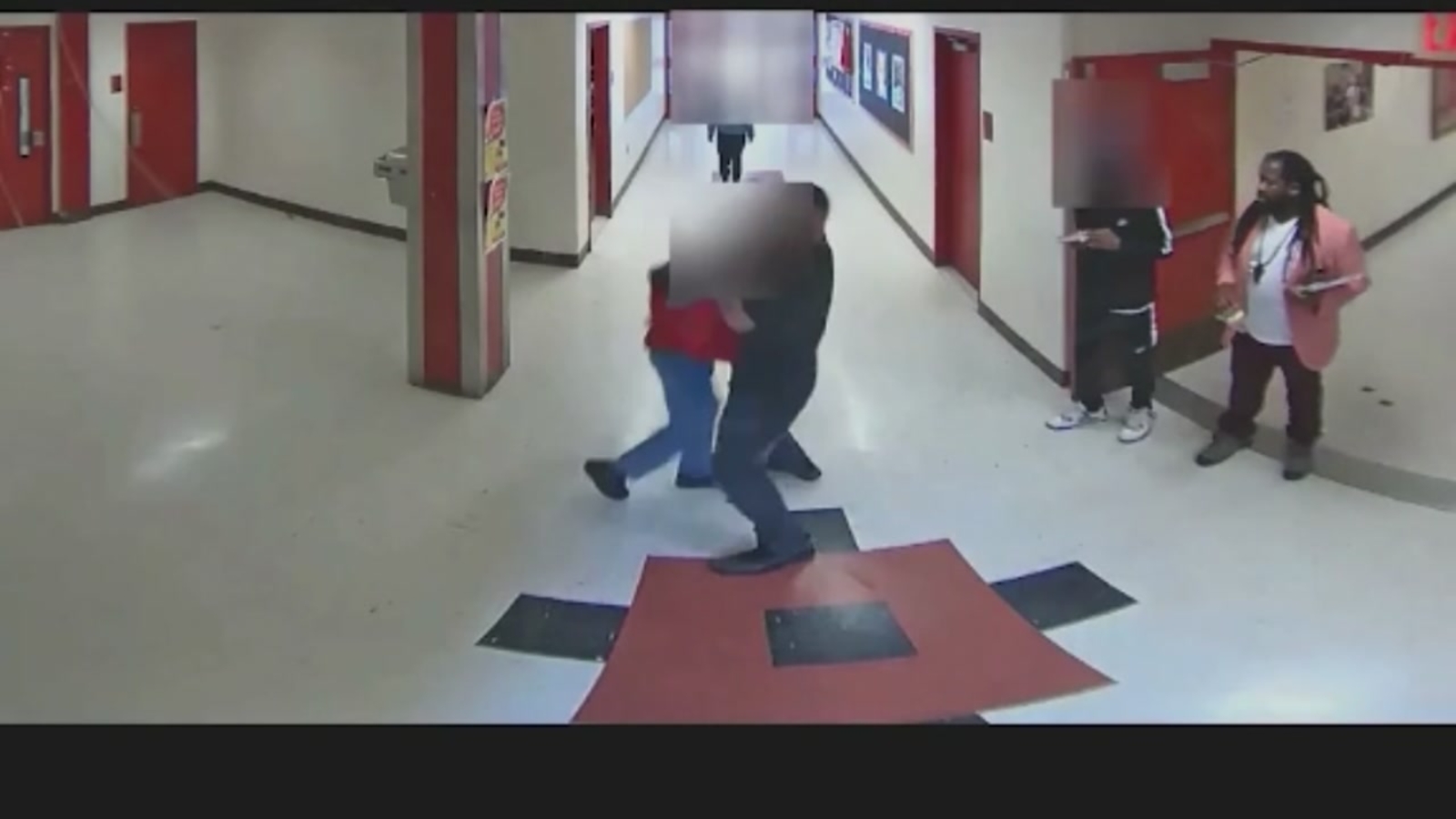 Violent brawl breaks out between school employee and student in hallway ...