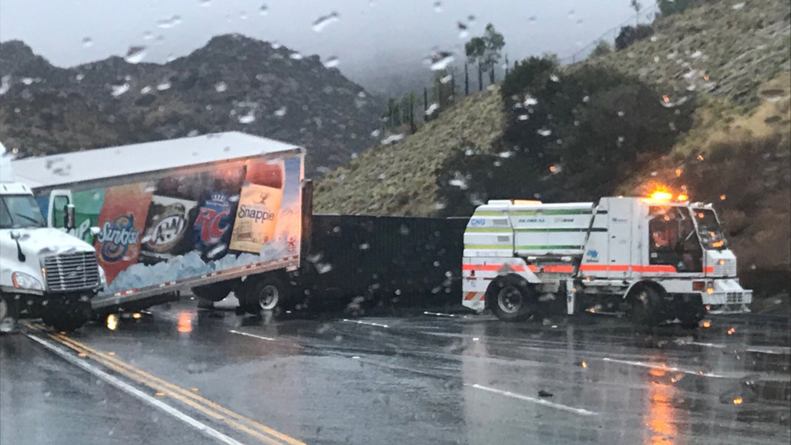 118 Freeway's WB lanes reopen after semi-truck hauling beverages ...
