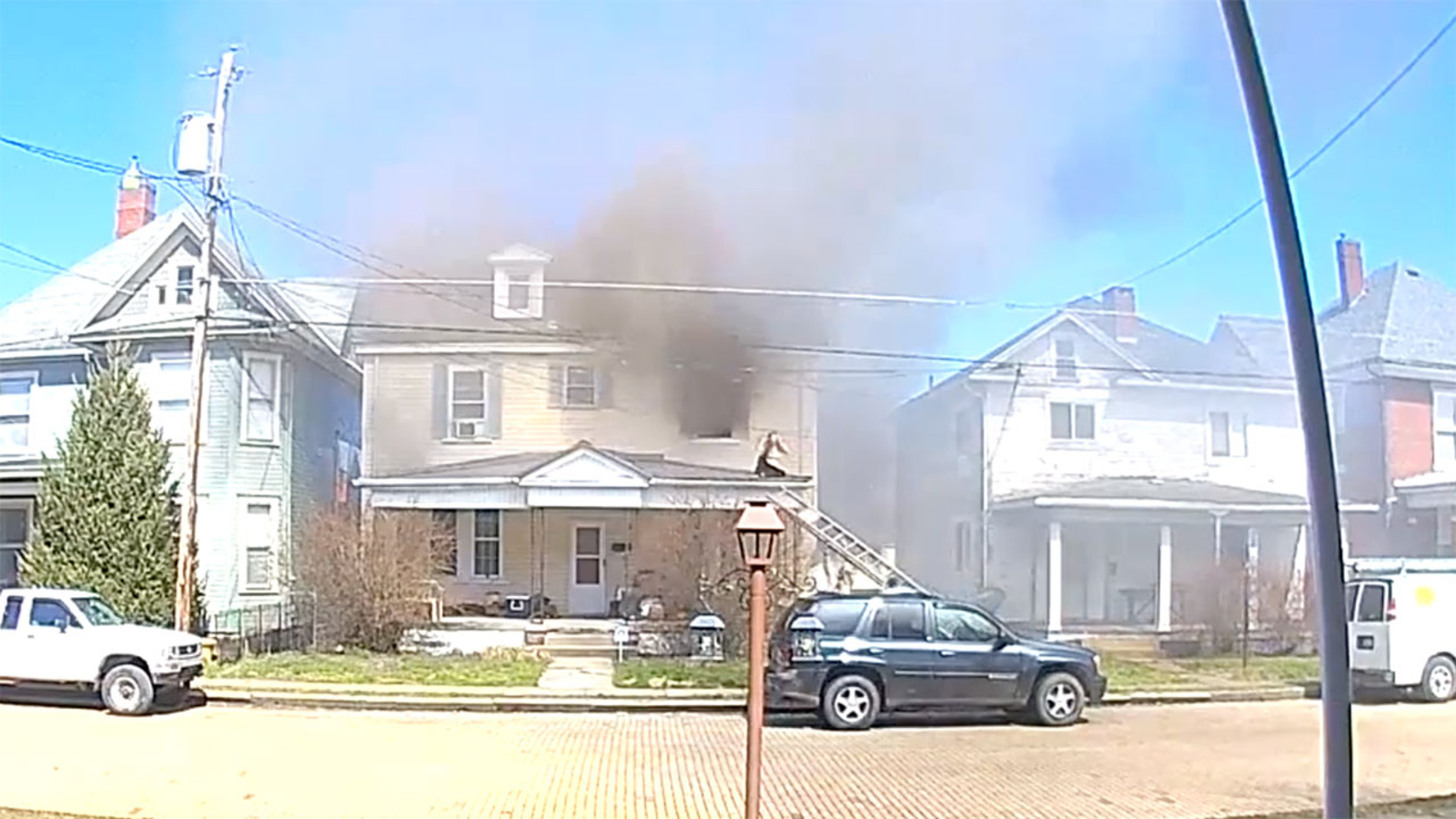 Neighbors rescue woman trapped on second story of burning W. Virginia ...