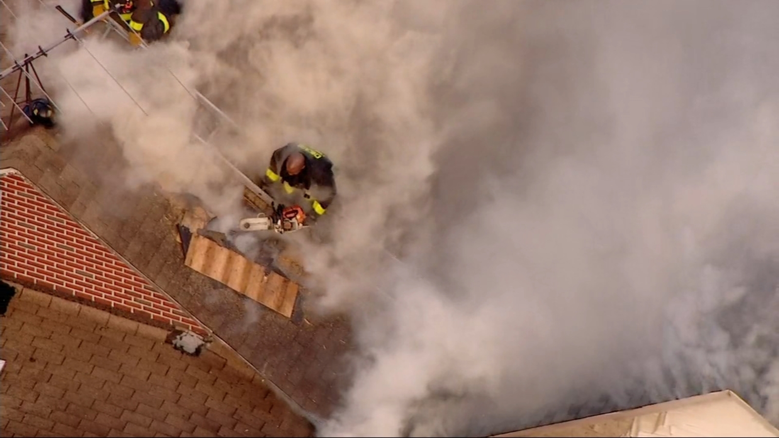 Firefighters battle fire in two Grand Crossing houses - ABC7 Chicago