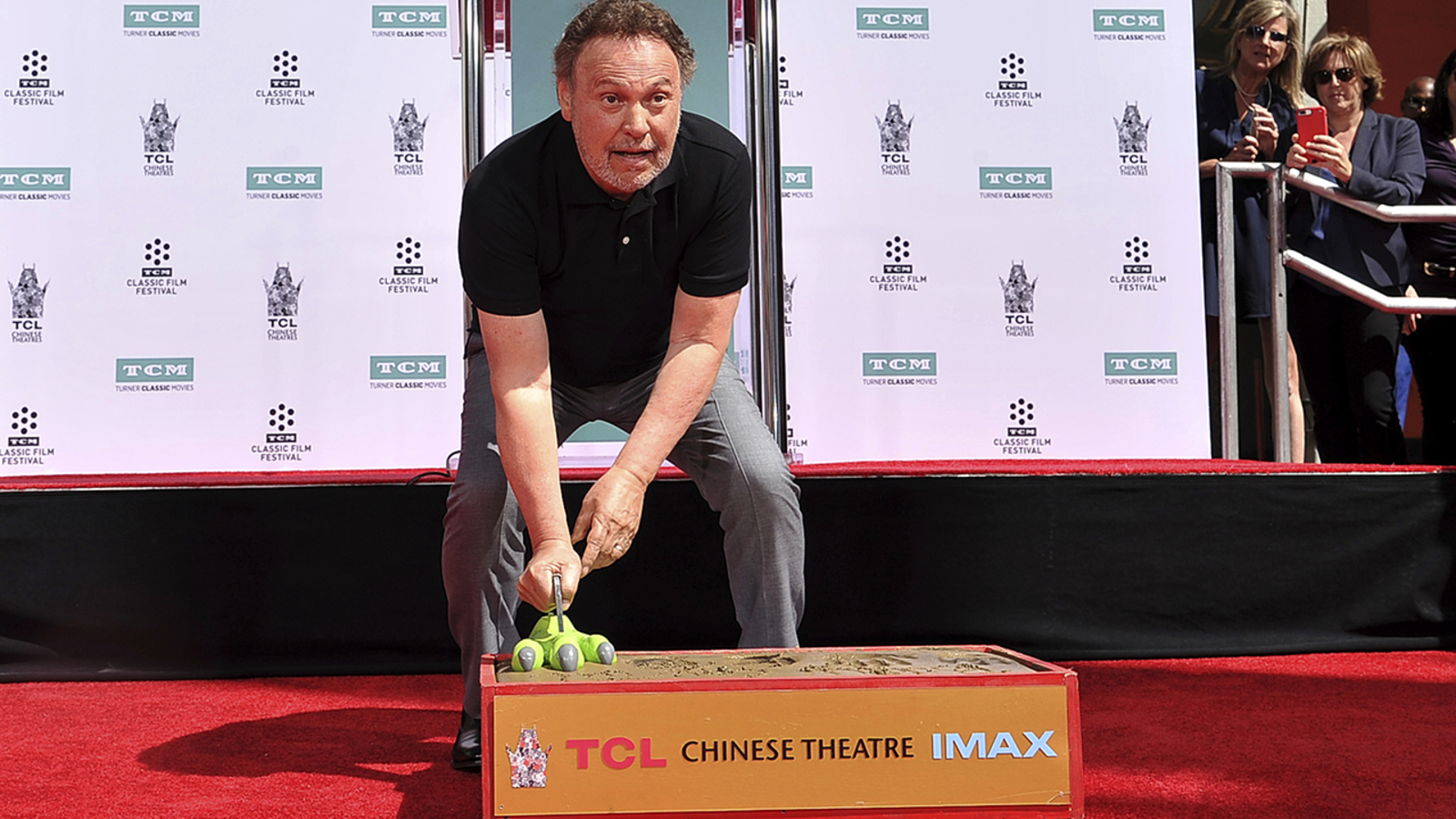 Billy Crystal places hands, Mike Wazowski foot in cement during ...