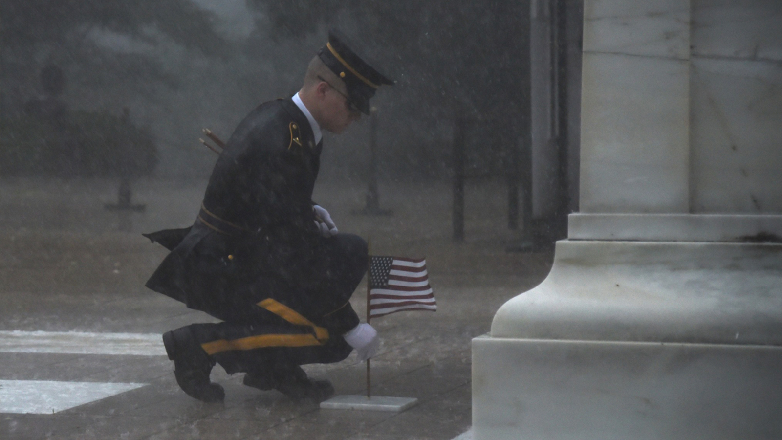 Memorial Day event at Arlington National Cemetery: Soldier places flag ...