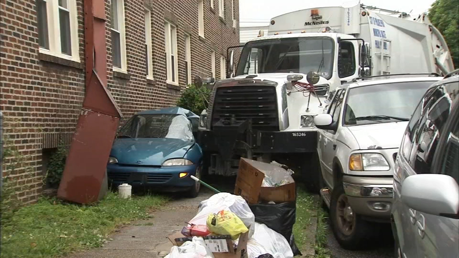 Trash truck and car collide, sending car into building - 6abc Philadelphia