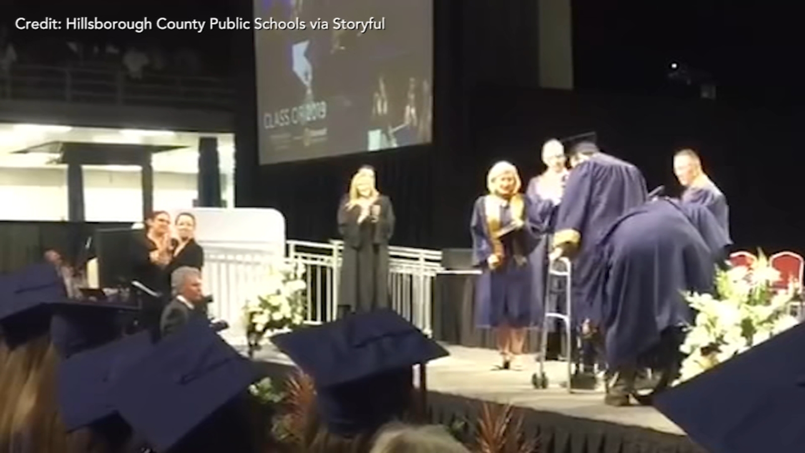 Student paralyzed after car accident walks across graduation stage ...