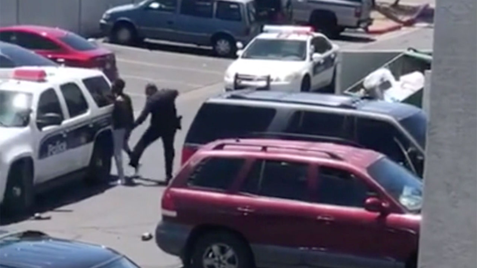 Phoenix police officer sweeps handcuffed man's leg, points gun at car ...