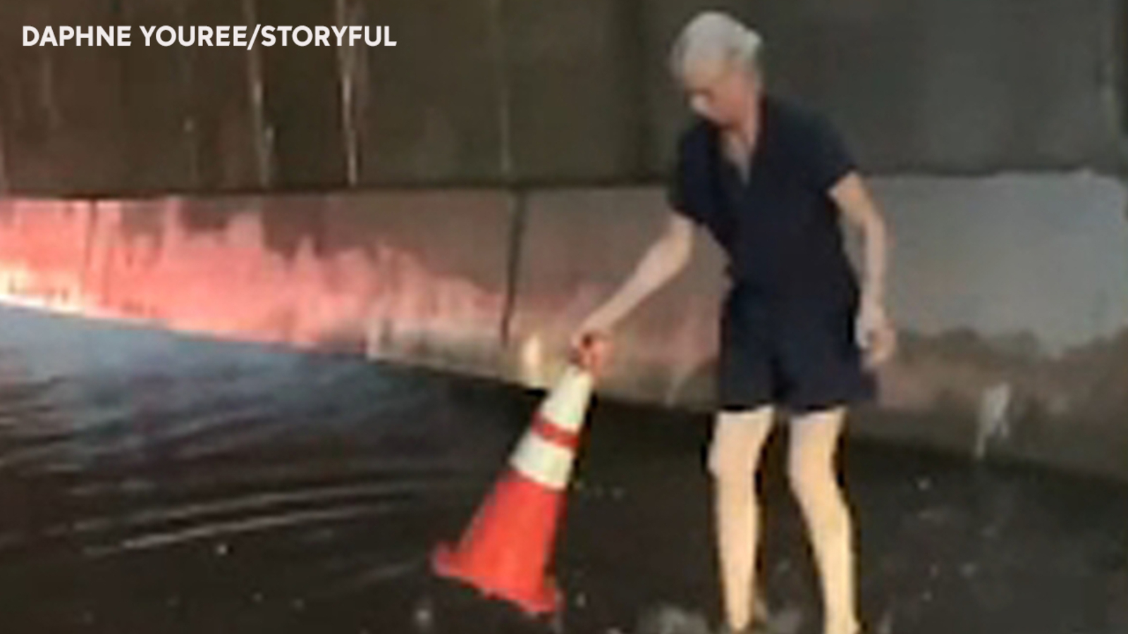 Woman uses traffic cone to unclog flooding on Long Island Expressway in ...