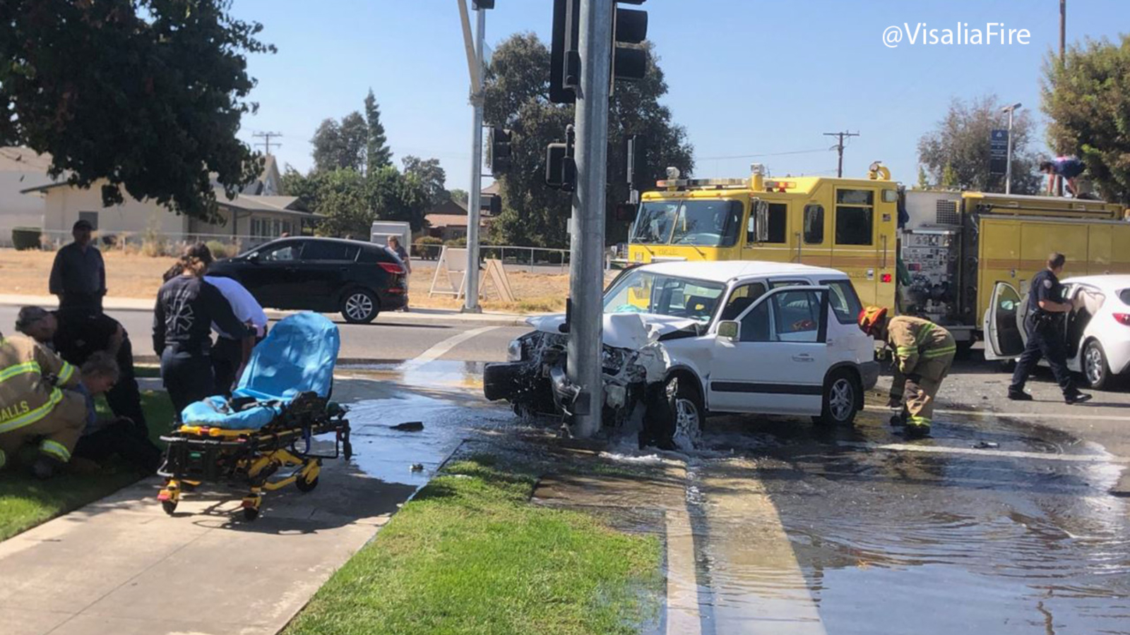 Visalia Firefighters Clean Up Water After Crash Into Fire Hydrant