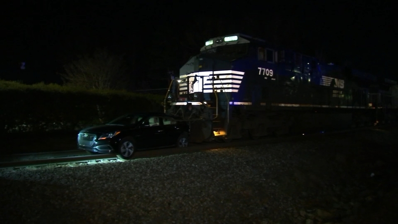 Norfolk Southern train collides with car stuck on tracks in Cary ...