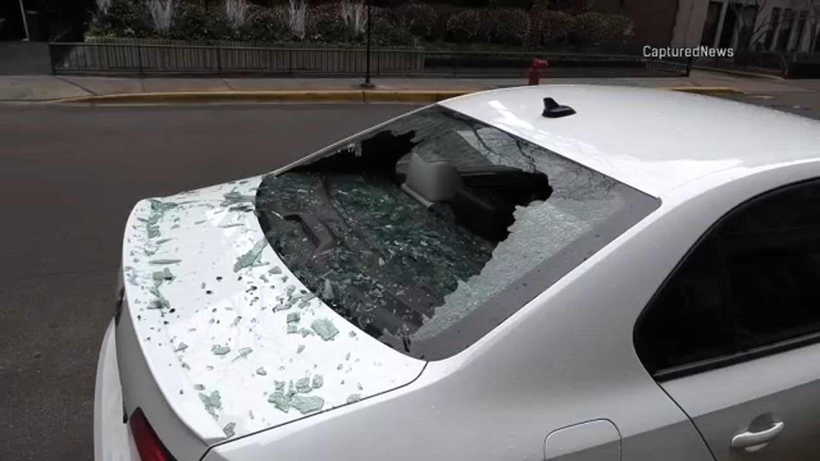 Falling ice shatters car window near former John Hancock building ...