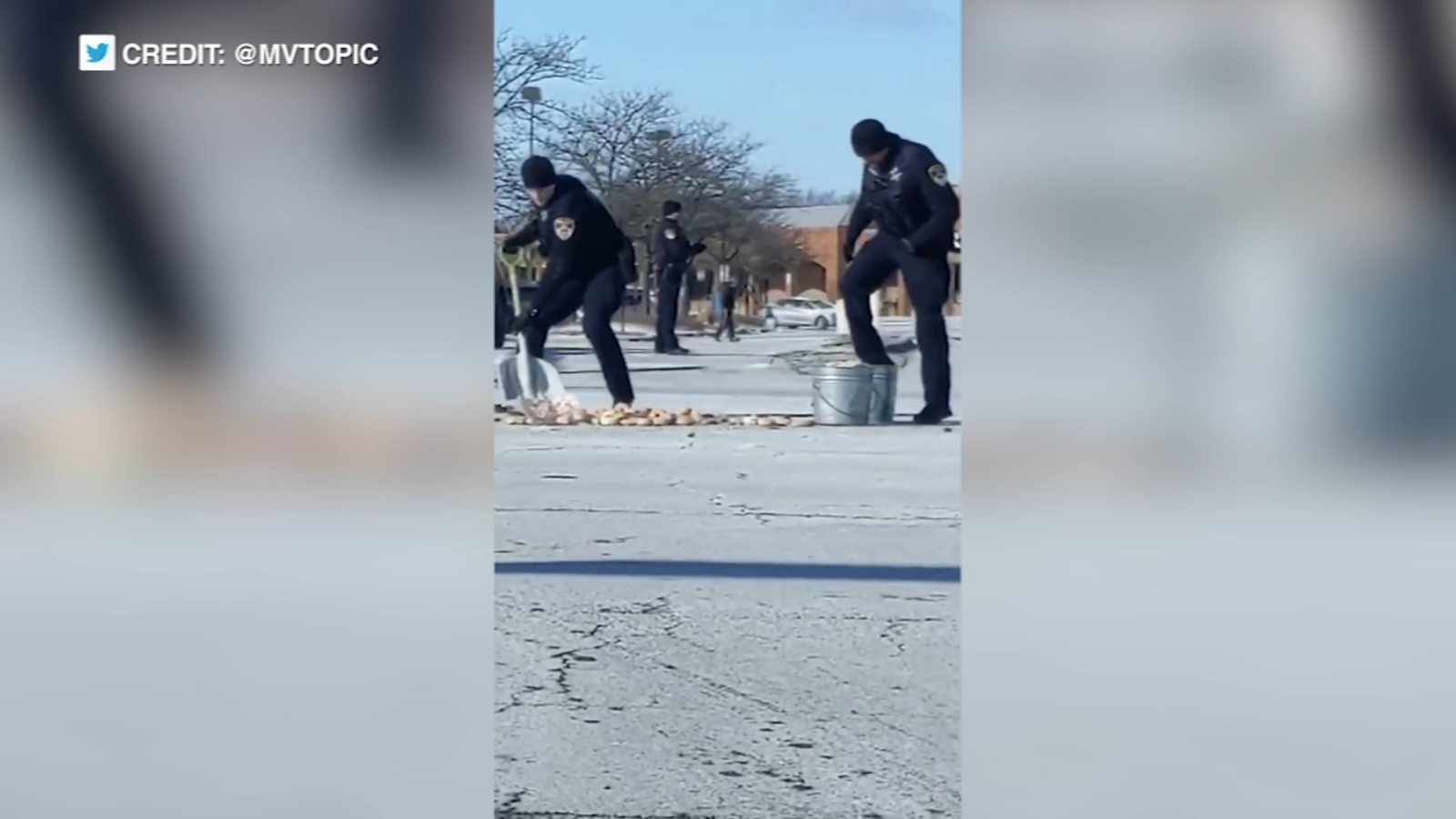 Wheaton police officers shovel donuts from Naperville Road intersection ...