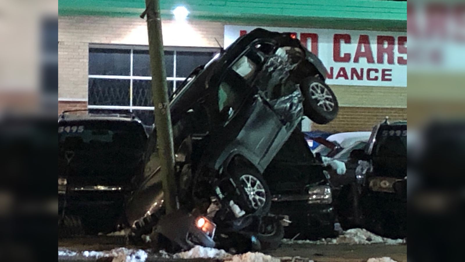 3 injured after SUV crashes into unmarked police car, dealership ...