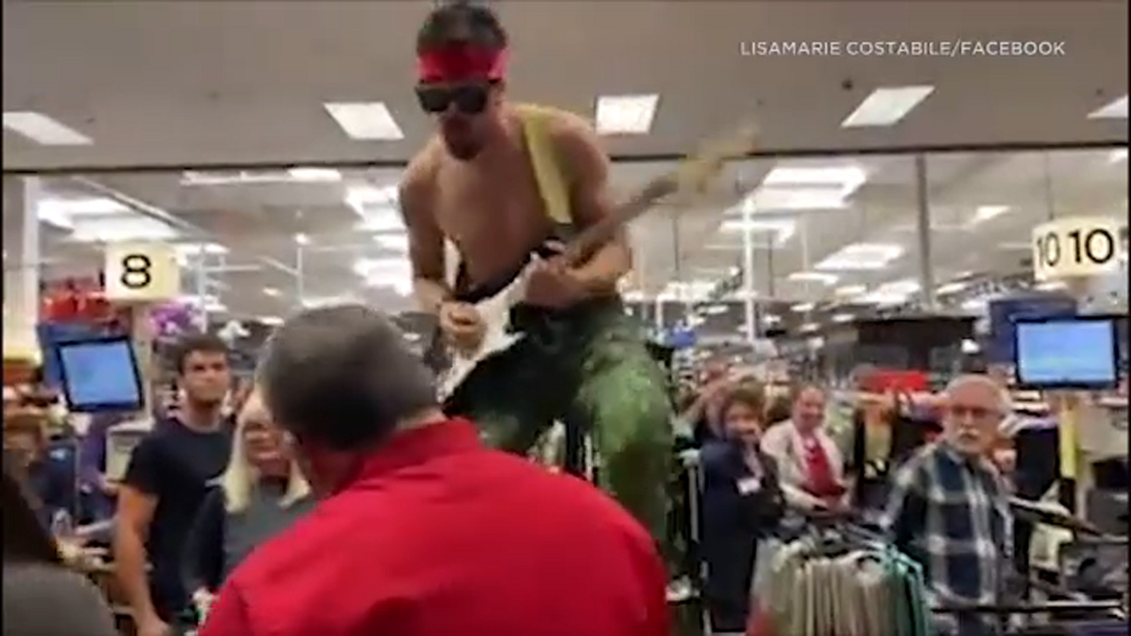 Guitarist jumps onto counter at Studio City Ralphs, rocks out in front ...