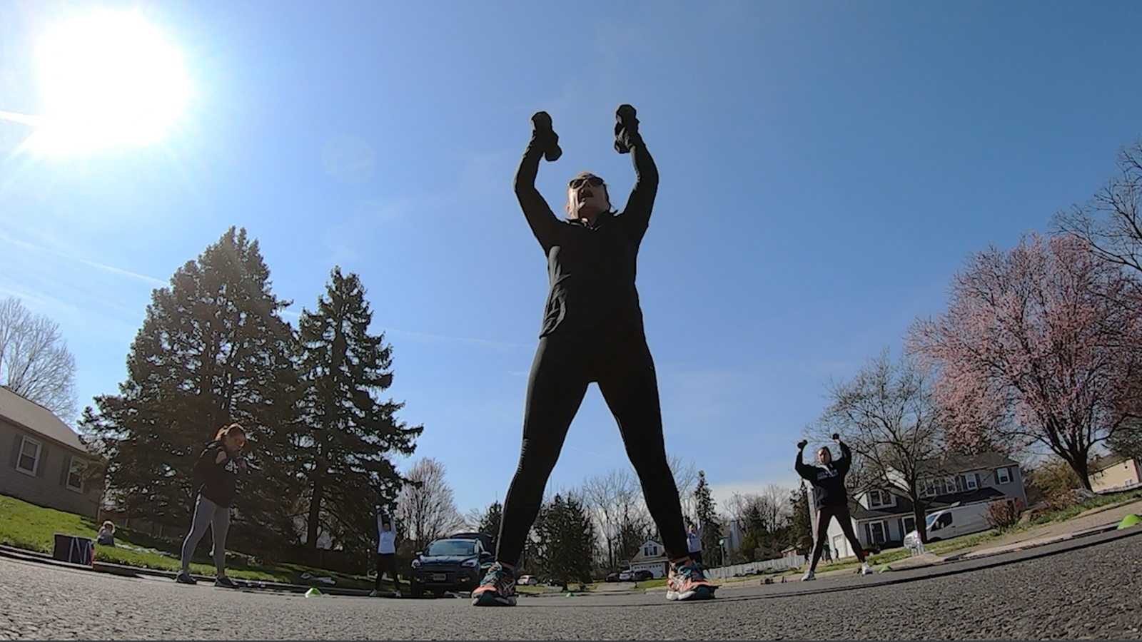 Neighbors create social distance workout from their front lawns - 6abc ...