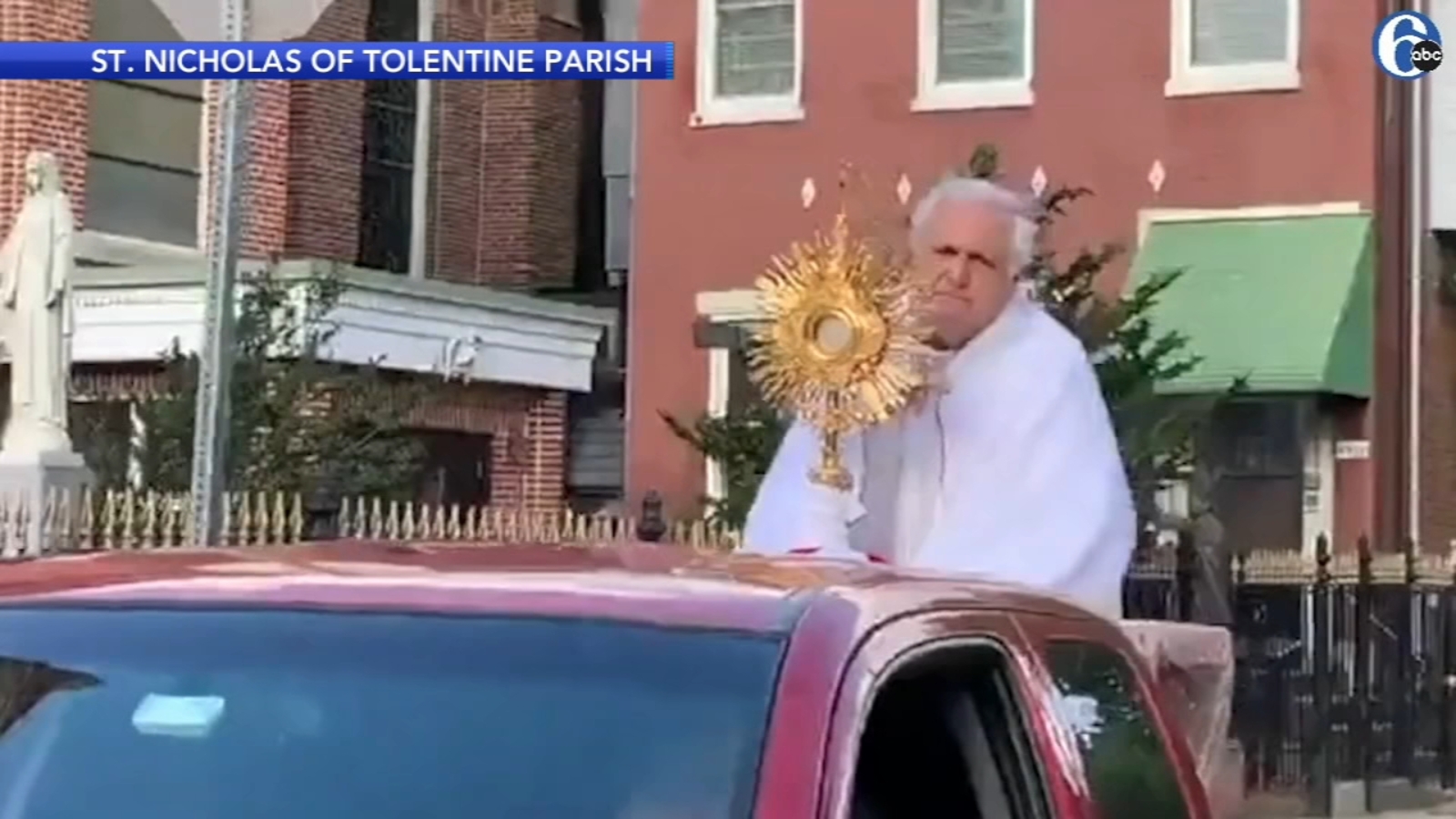 Father Martorano of St. Nicholas Of Tolentine Parish rides in truck ...