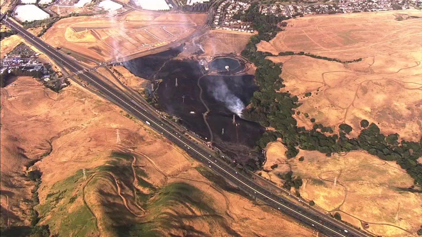 Crews battling 2-alarm brush fire threatening structures in Fairfield ...