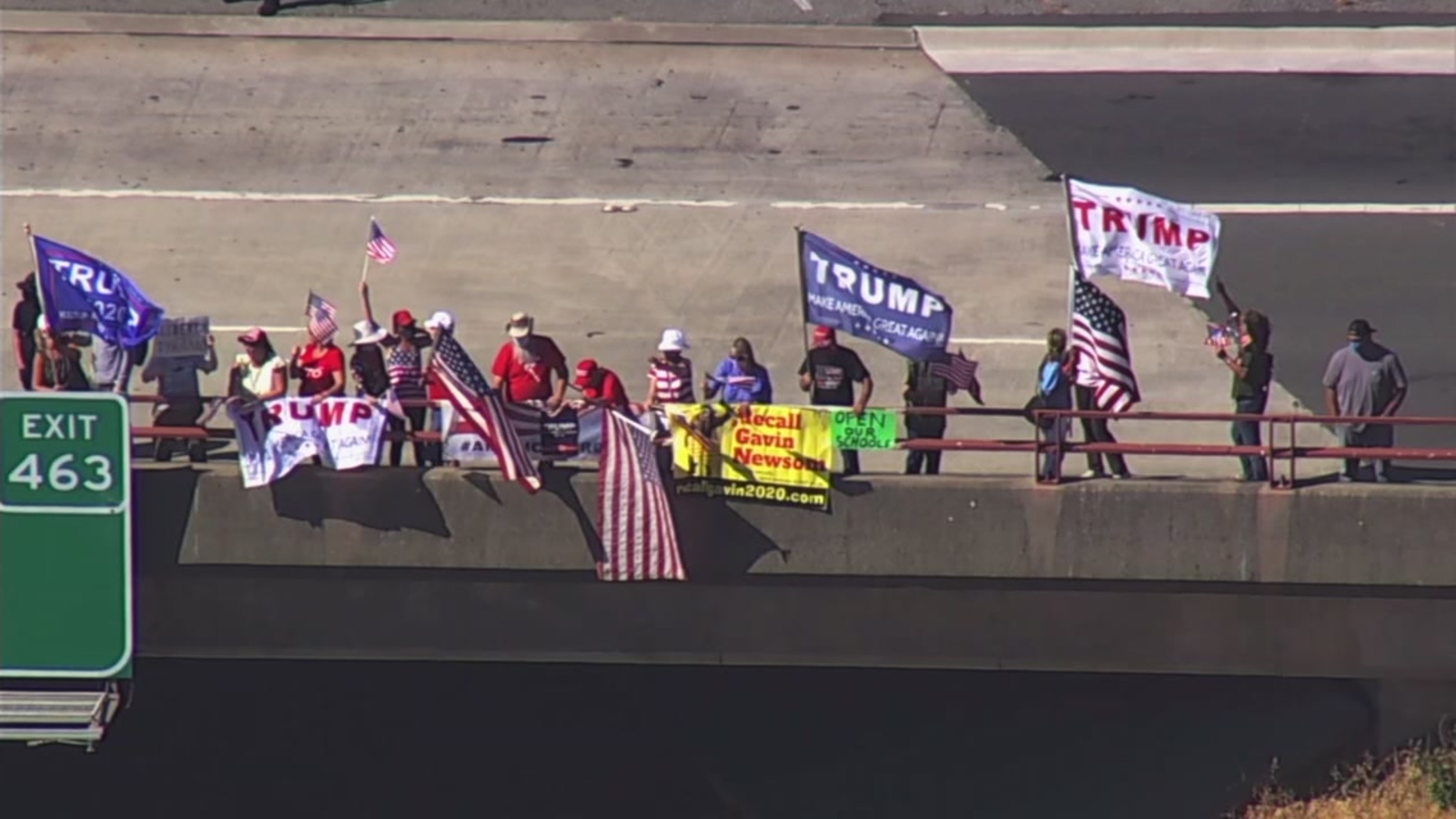 President Donald Trump supporters, counter-protesters were on overpass ...