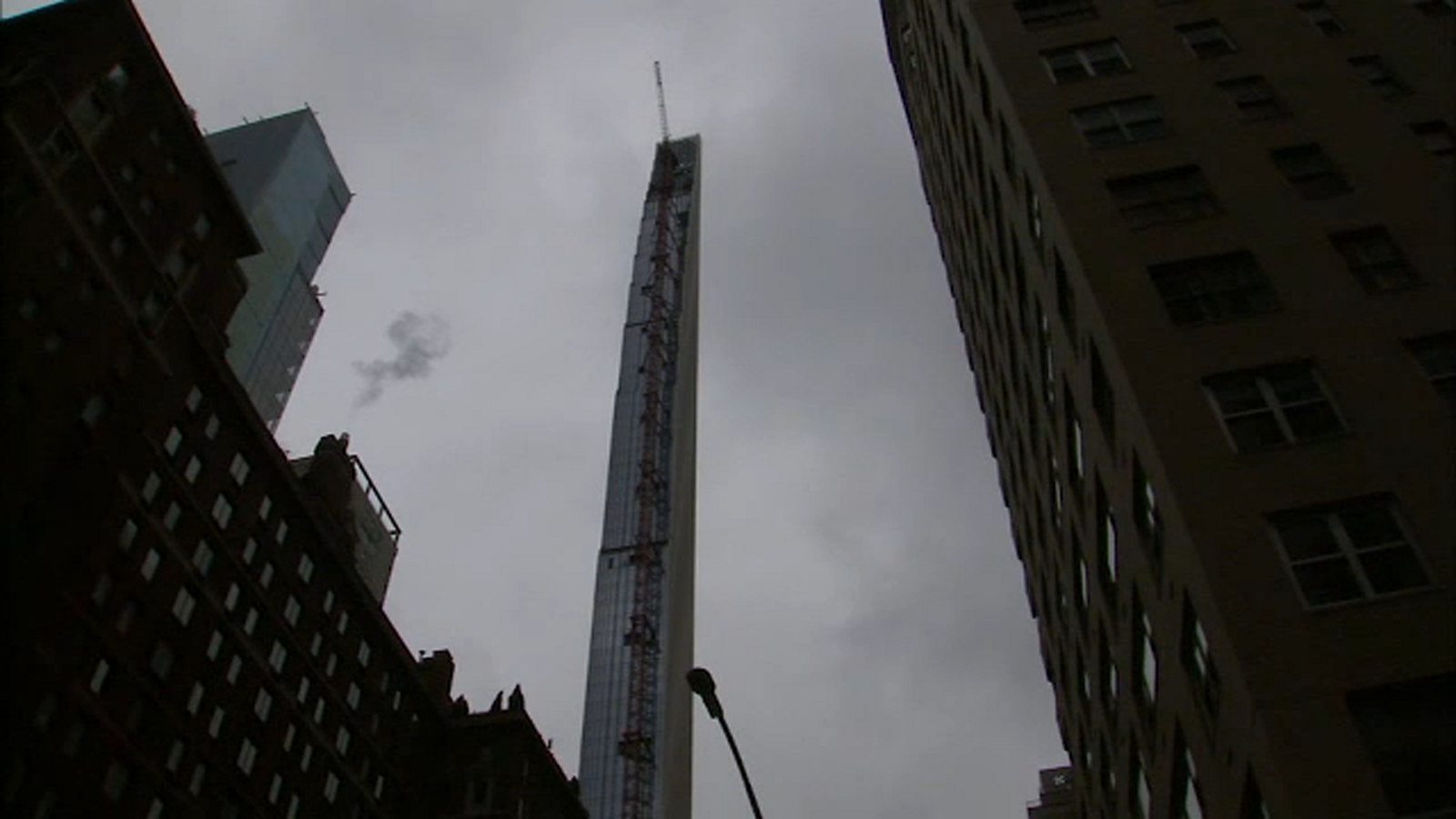 Glass falls from building weeks after spinning crane sends debris ...