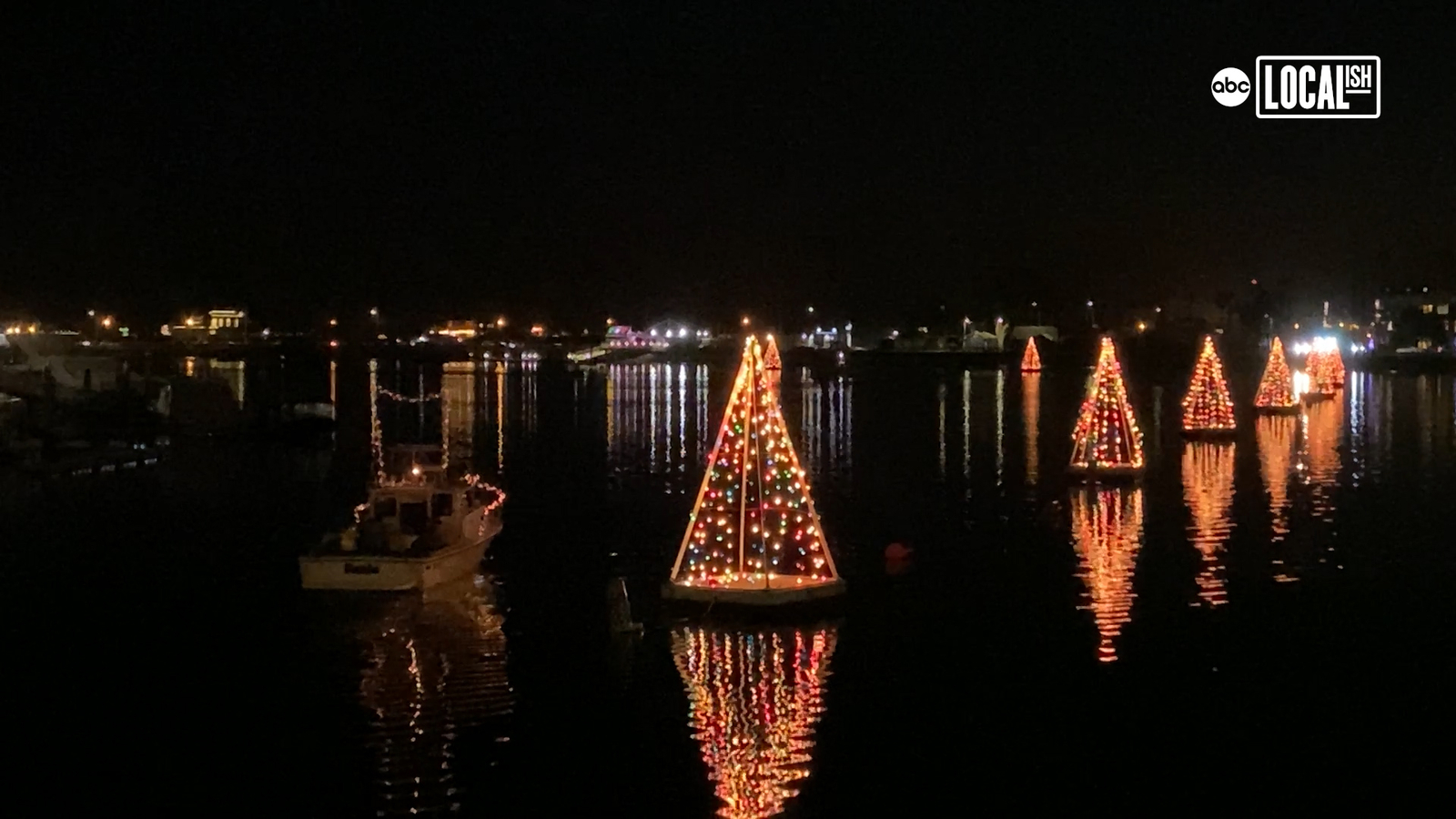Floating Christmas trees light up bay continuing holiday tradition ...